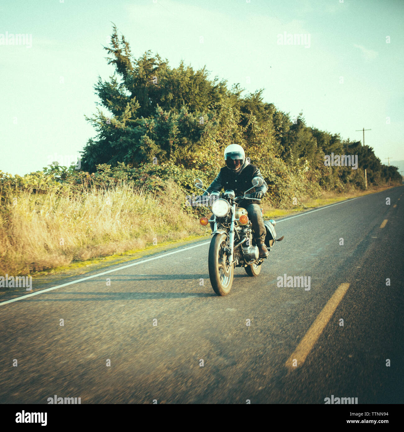 Riding motorcycle on country road hi-res stock photography and images ...
