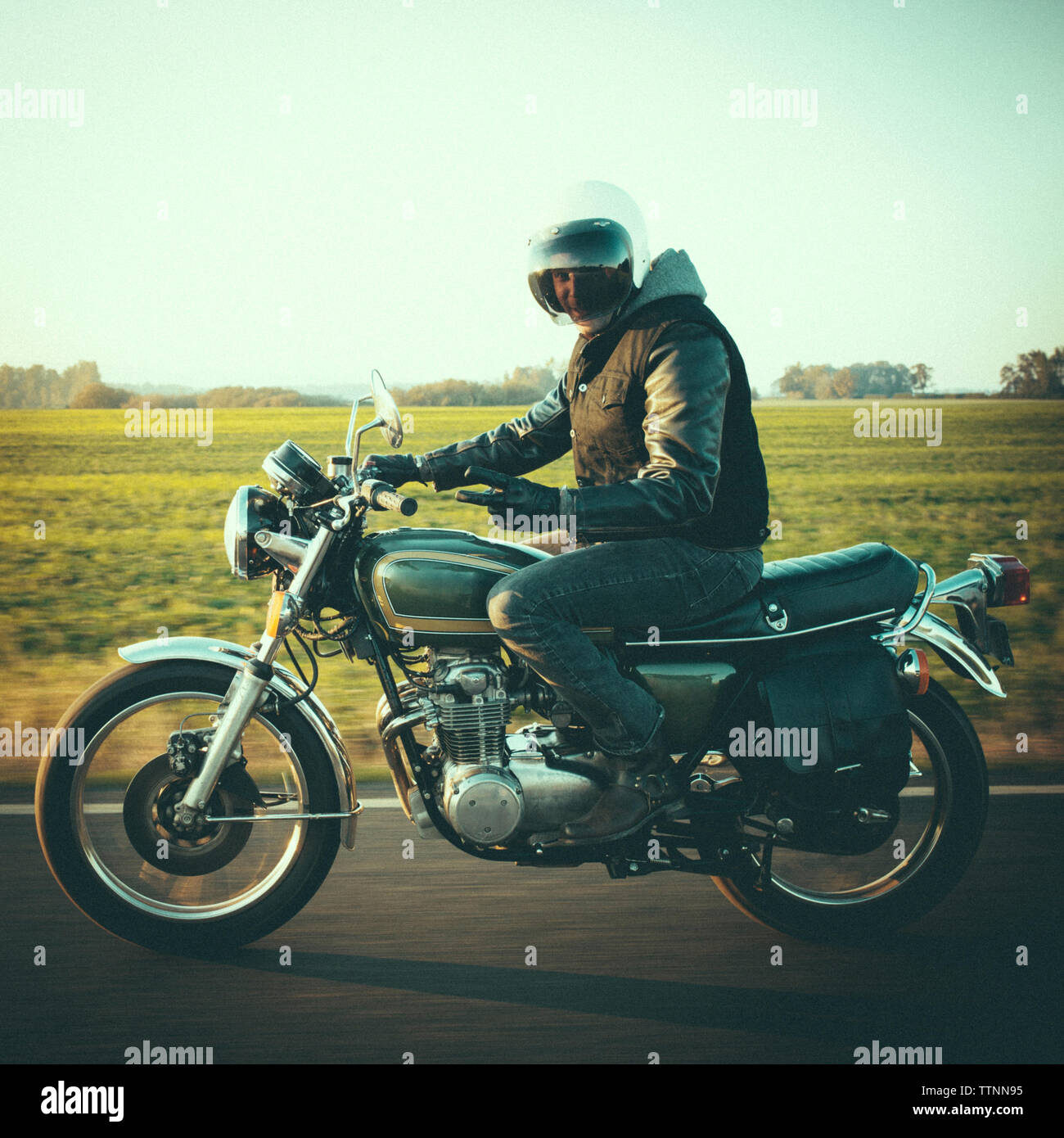 Riding motorcycle helmet country road hi-res stock photography and ...