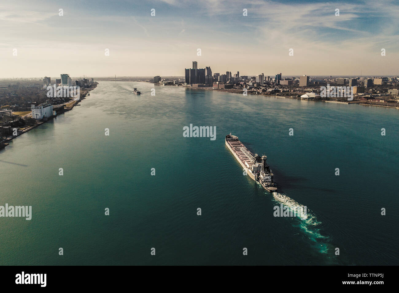 Aerial view of container ships on River against sky Stock Photo - Alamy