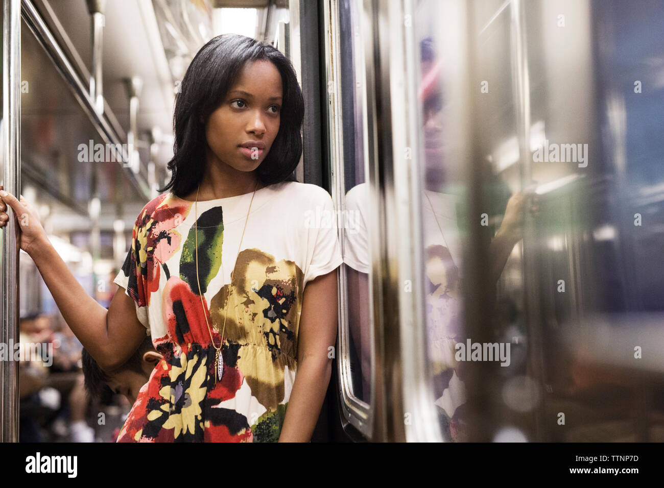 Woman standing train hi-res stock photography and images - Alamy