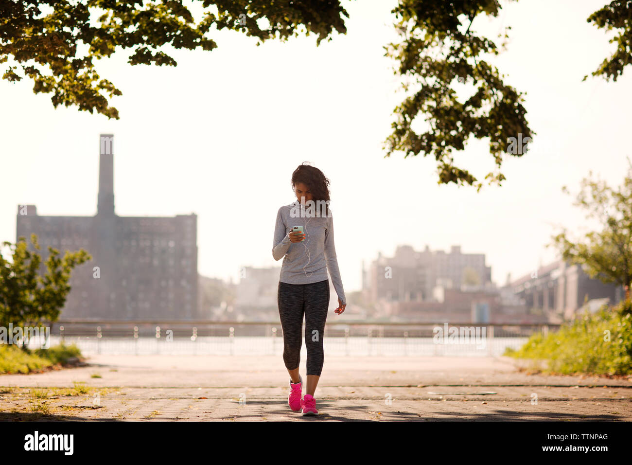 Walking with headphones hi-res stock photography and images - Alamy