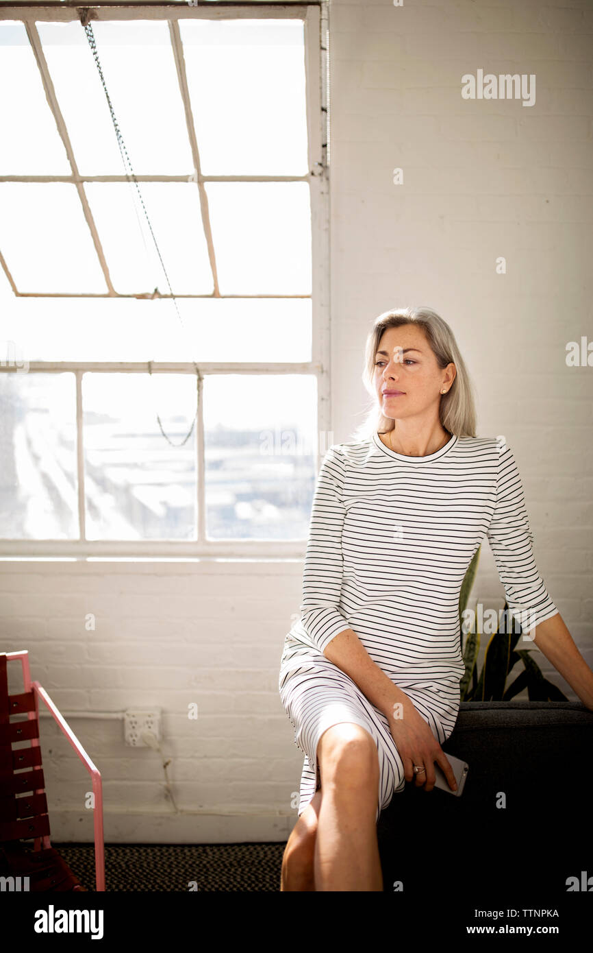 Woman crossed legs hi-res stock photography and images - Alamy