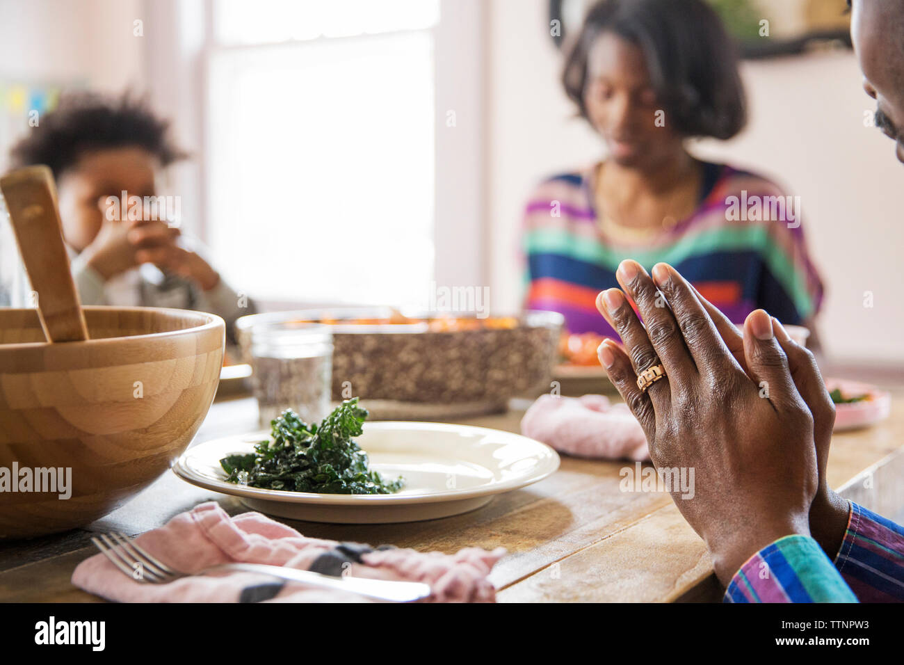 Old woman saying grace hi-res stock photography and images - Alamy