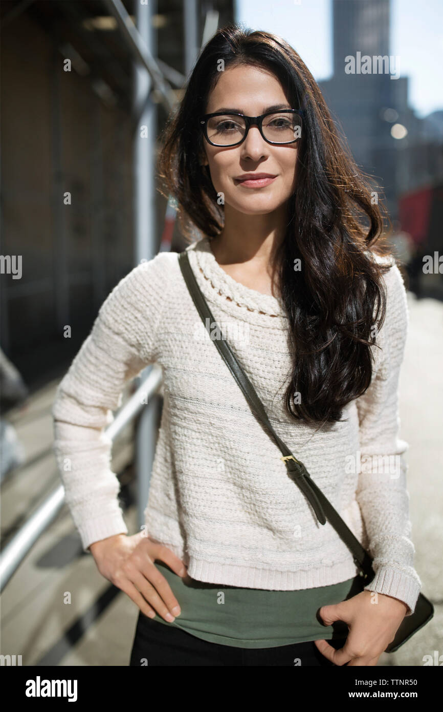 Young woman standing on city hi-res stock photography and images - Alamy