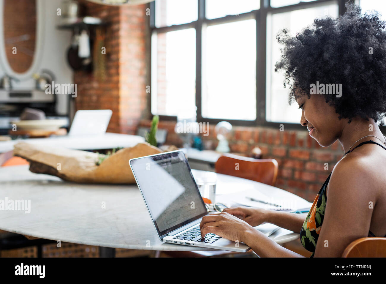 Woman home computer african screen hi-res stock photography and images ...
