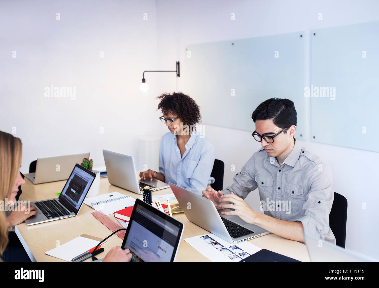Indian businesswomen using computers hi-res stock photography and ...