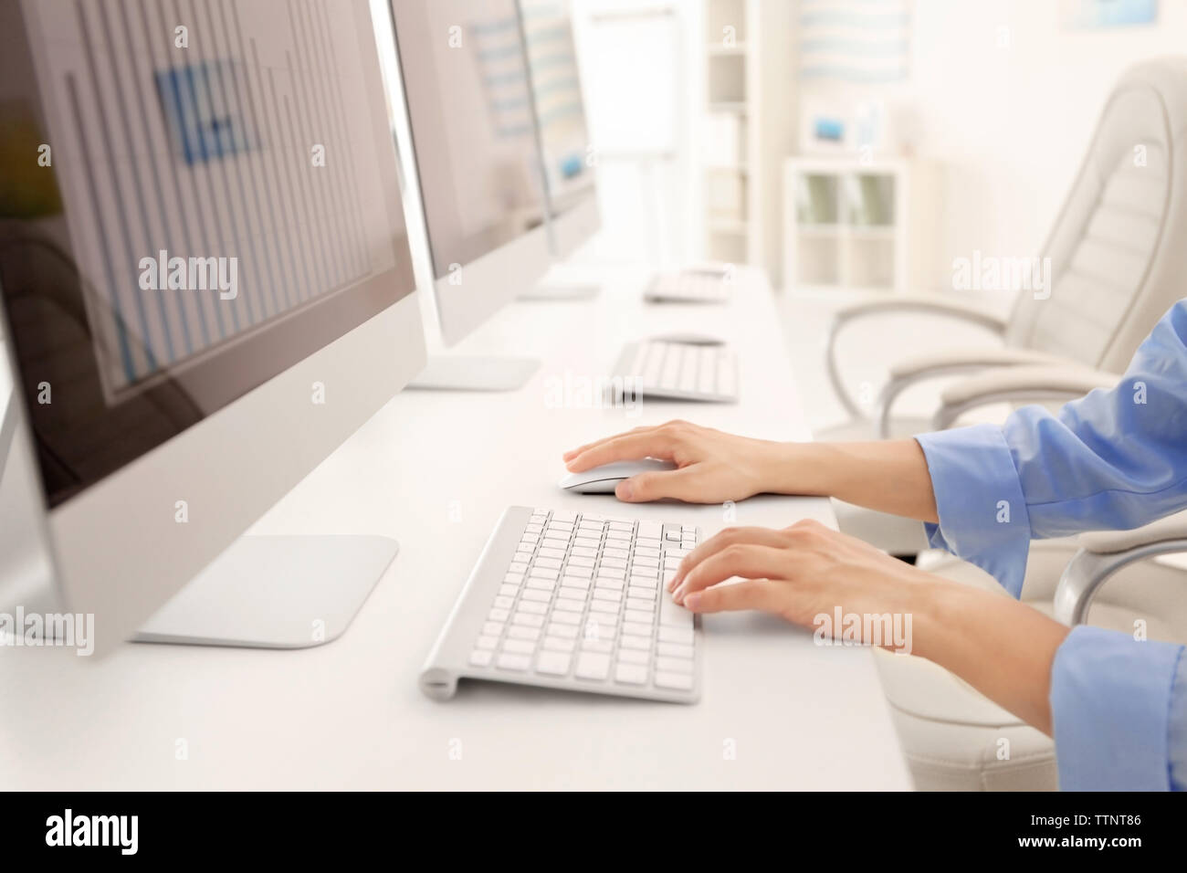 Woman typing on computer keyboard Stock Photo - Alamy