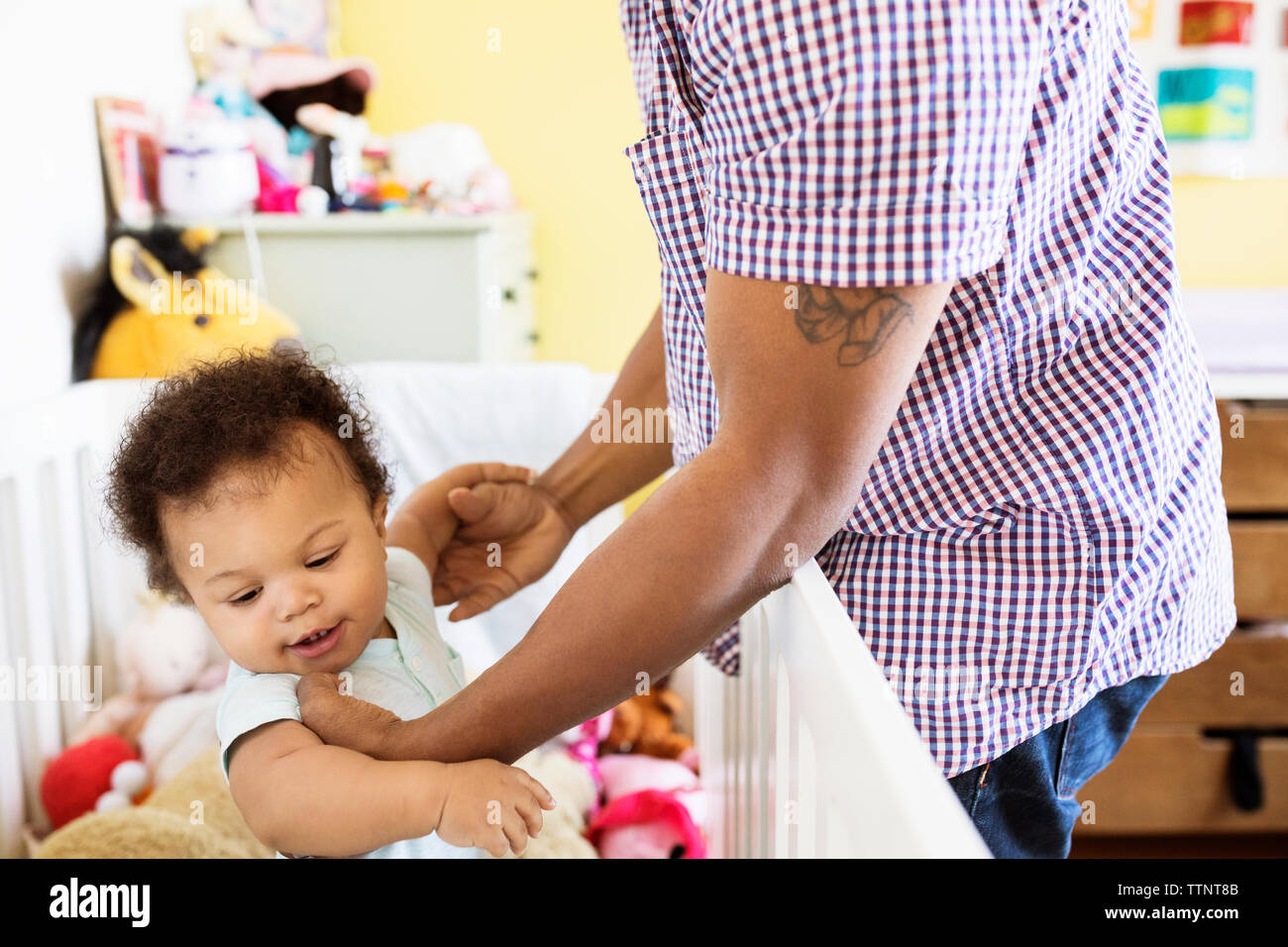Baby standing up in crib hi-res stock photography and images - Alamy