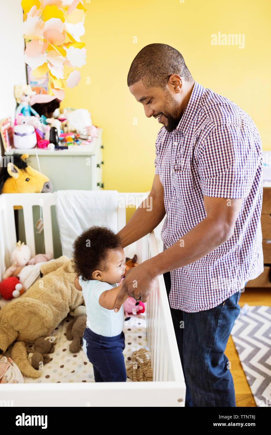 Playing in crib hi-res stock photography and images - Alamy