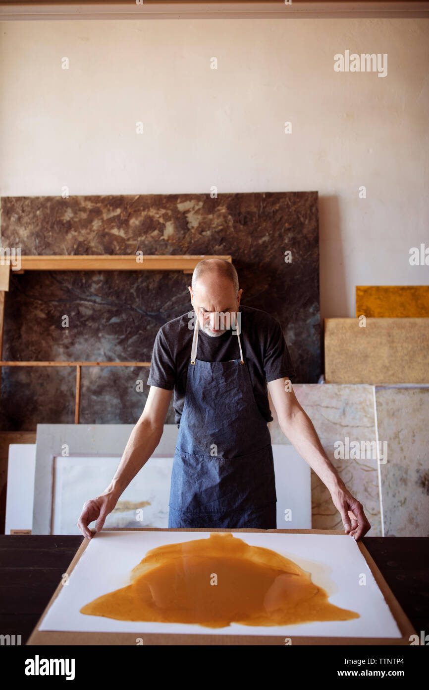 Male artist holding painting hi-res stock photography and images - Alamy