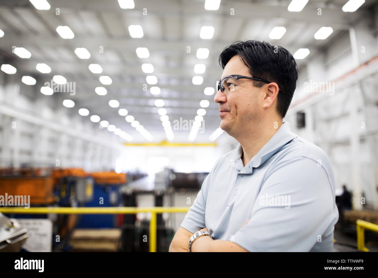 Standing smiling looking away authority hi-res stock photography and ...