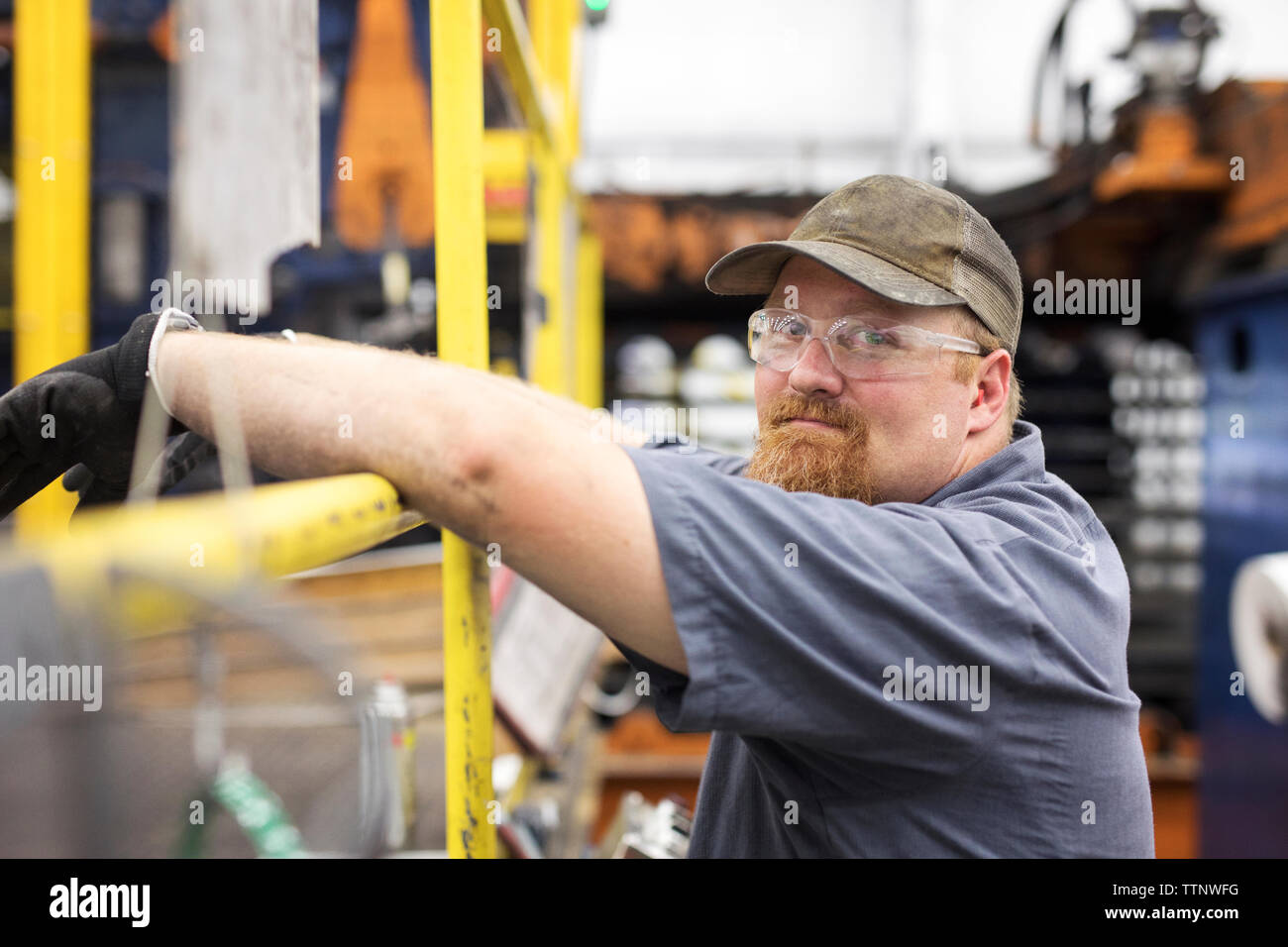 Side view portrait of worker in Steel industry Factory Stock Photo - Alamy