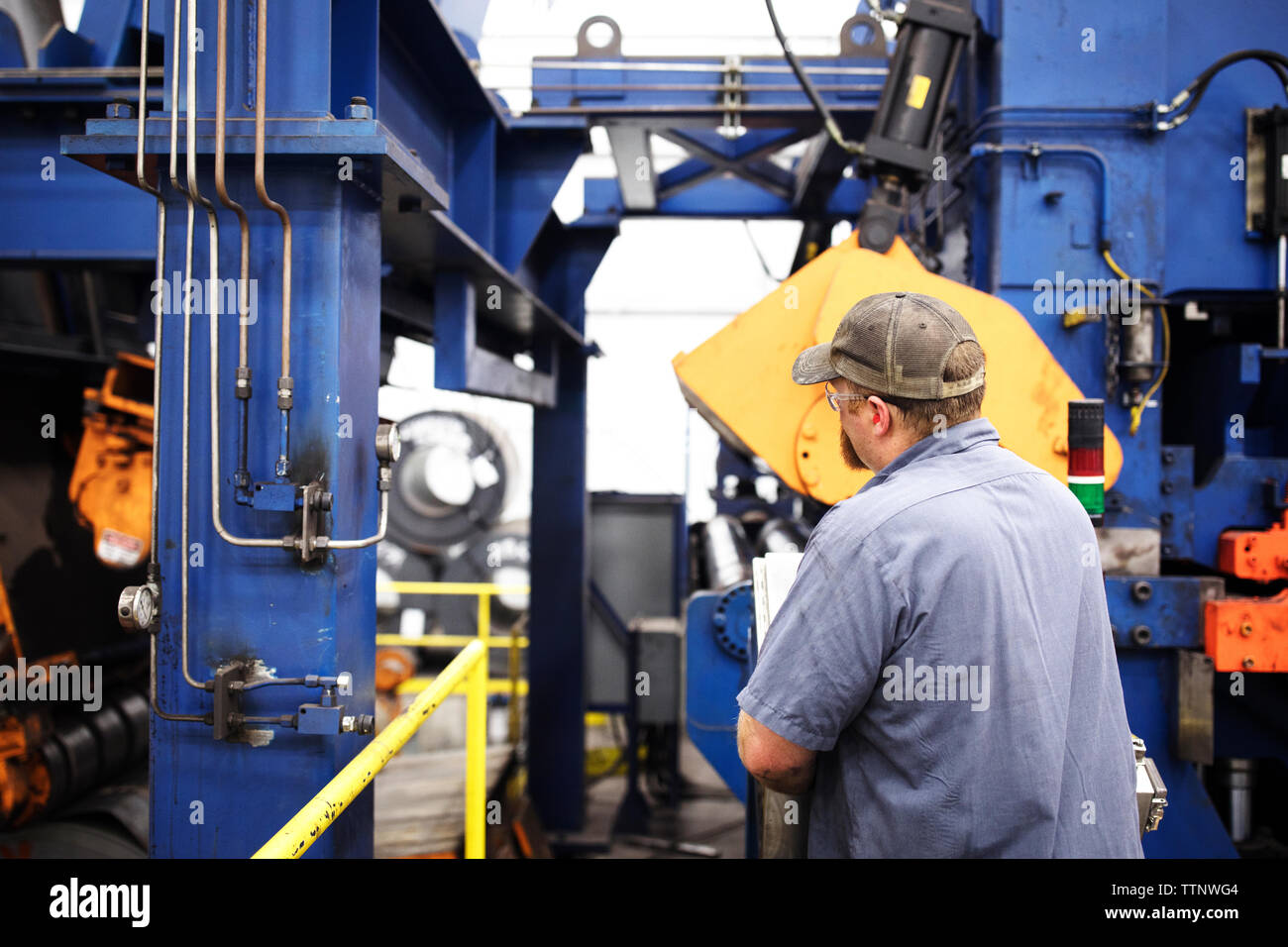 Male worker working in warehouse Stock Photo - Alamy
