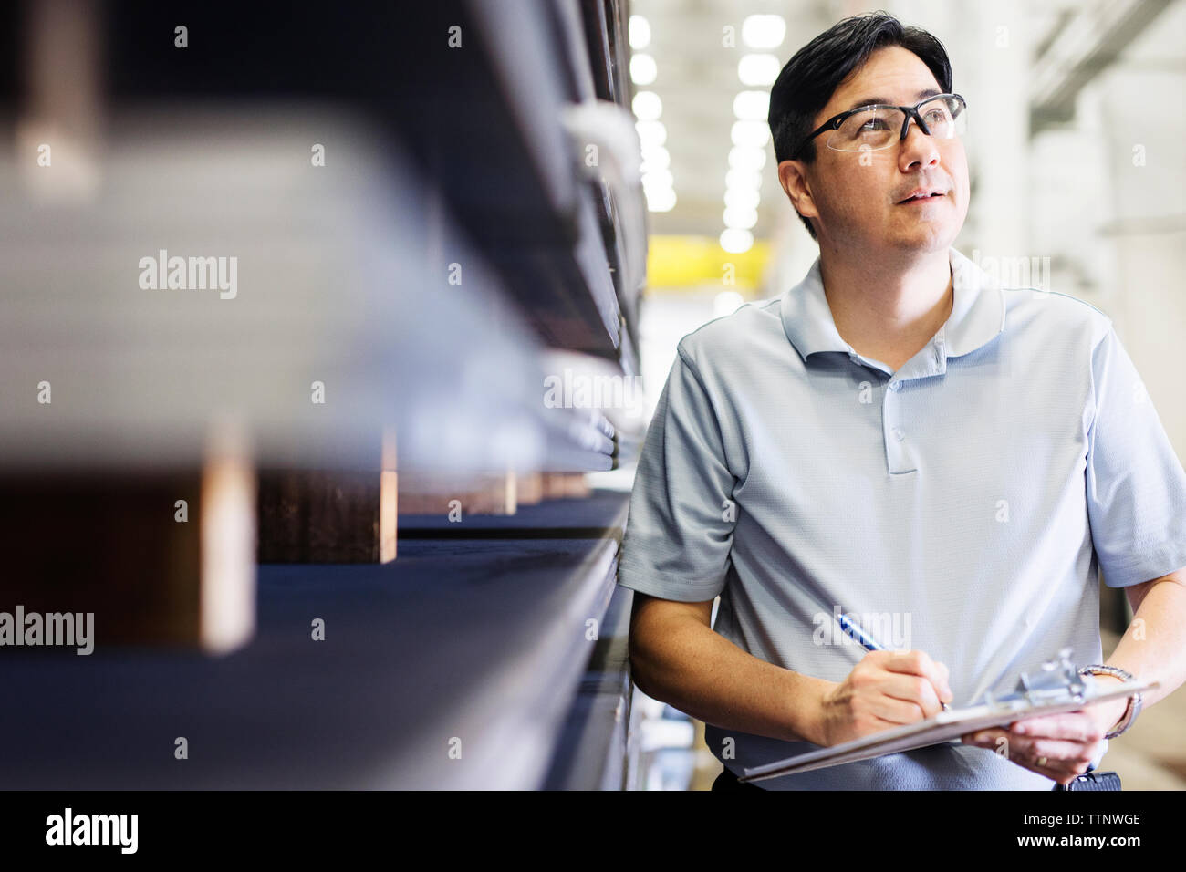 Old male thoughtful supervisor standing hi-res stock photography and ...