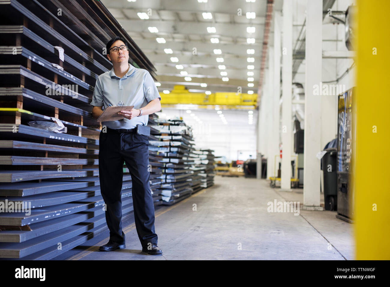 Old male thoughtful supervisor standing hi-res stock photography and ...