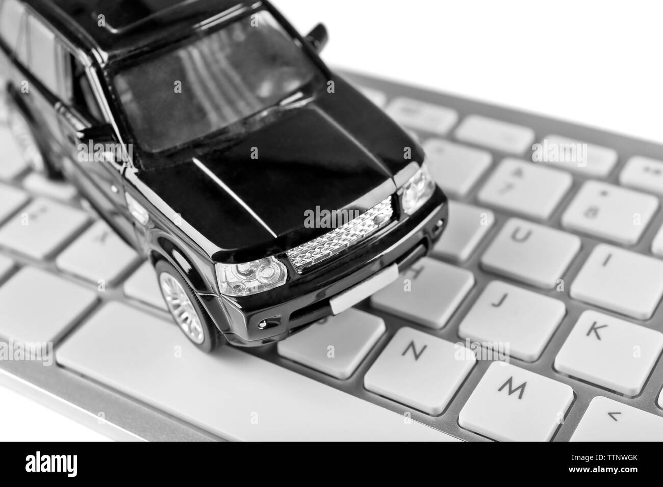 Toy car on keyboard Stock Photo - Alamy