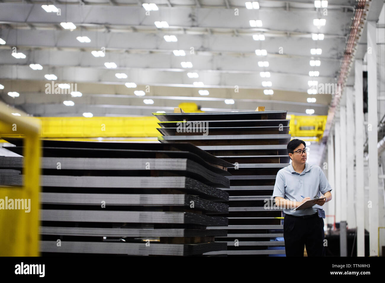 Old male thoughtful supervisor standing hi-res stock photography and ...