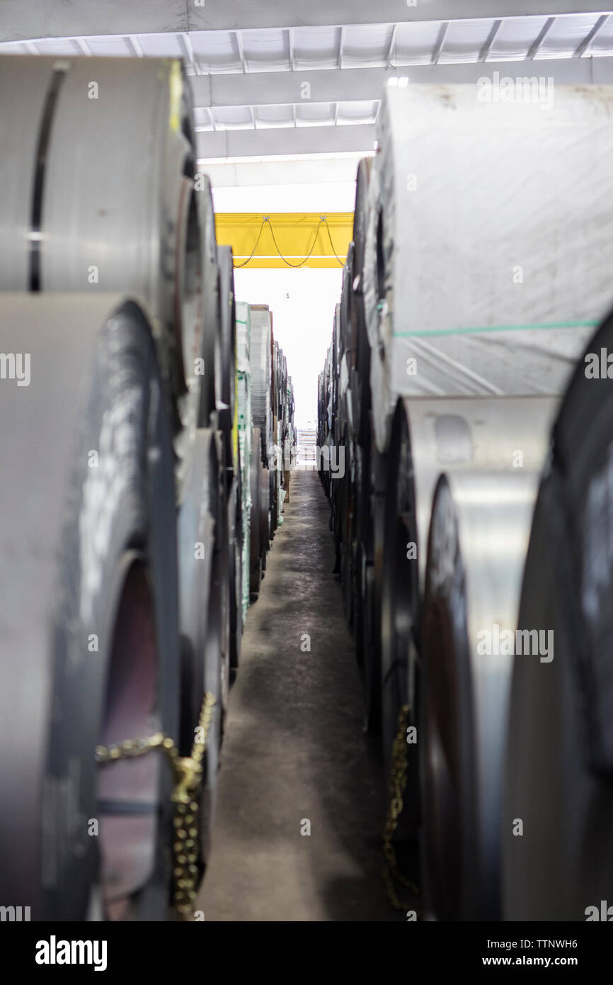 Rolled up metal sheets arranged in row at Steel Mill Stock Photo - Alamy