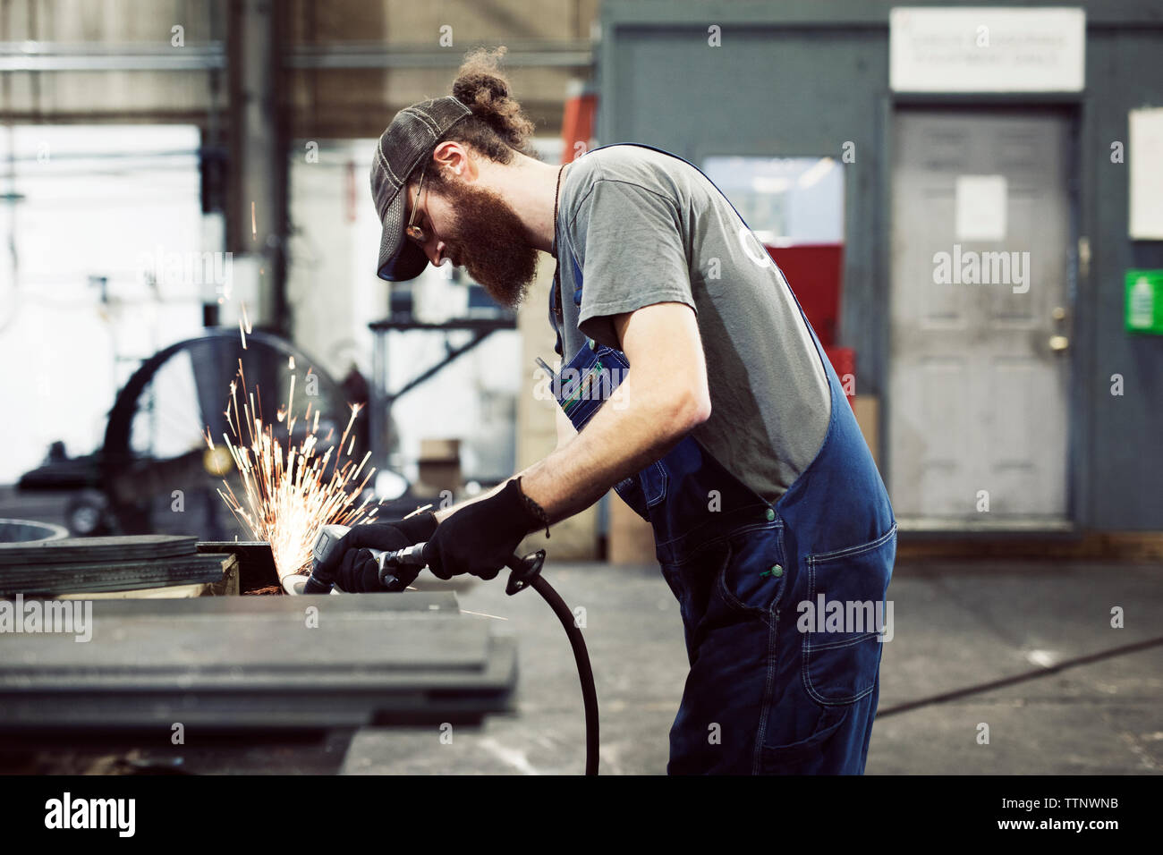 Side view serious male welder hi-res stock photography and images - Alamy