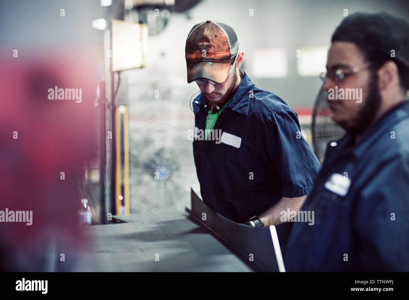 Workers working in steel industry Stock Photo - Alamy