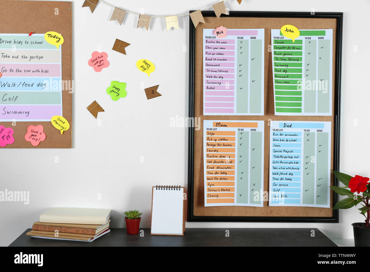 Family to-do list hanging on the wall Stock Photo - Alamy