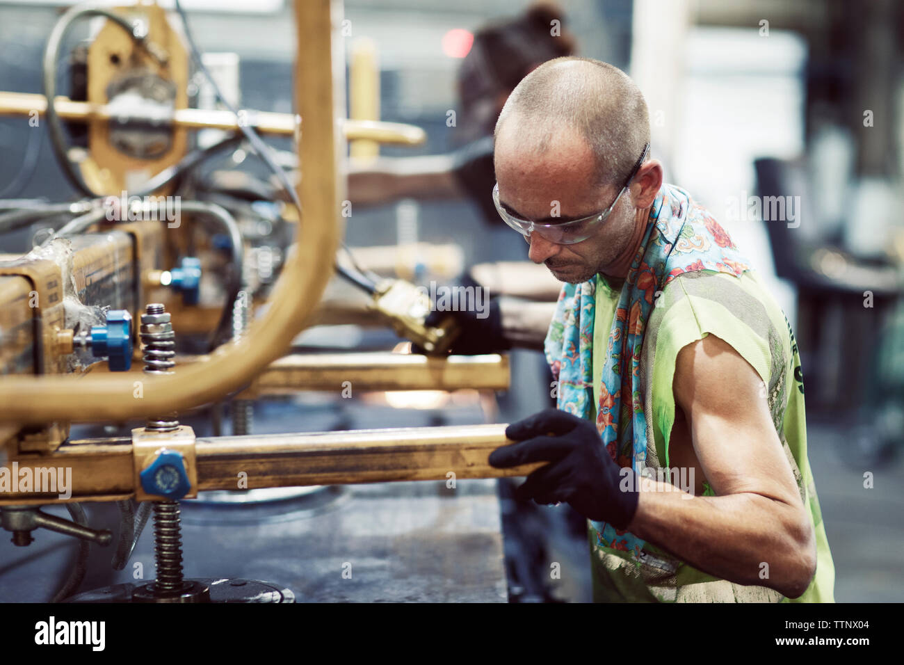 workers working on machinery in industry Stock Photo - Alamy