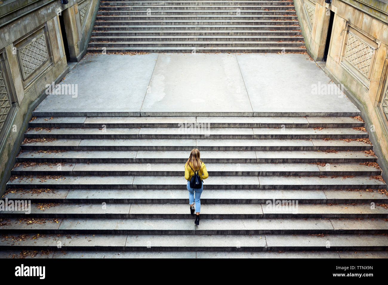 Person climbing up steps hi-res stock photography and images - Alamy
