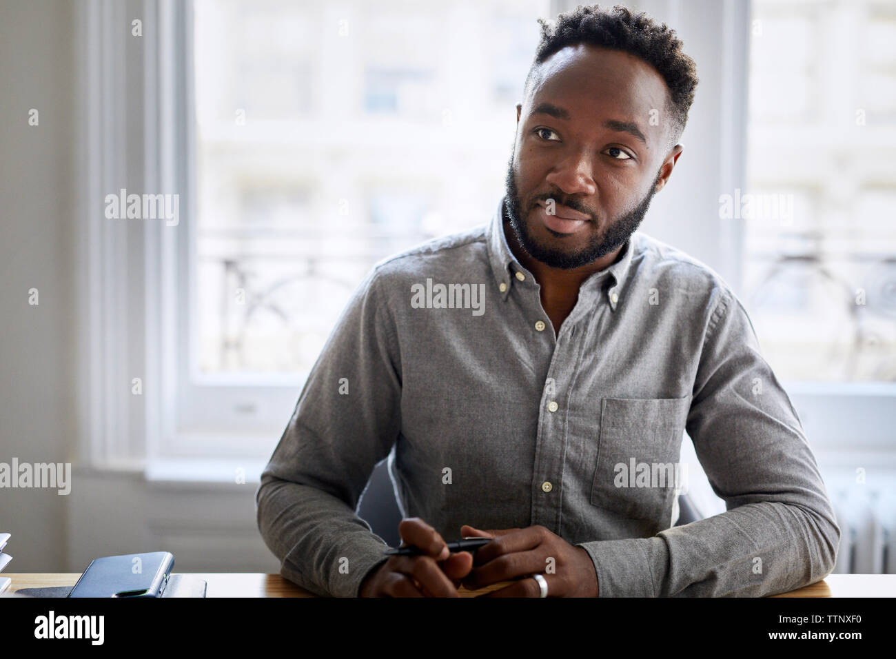 Professional creative person sitting desk hi-res stock photography and ...