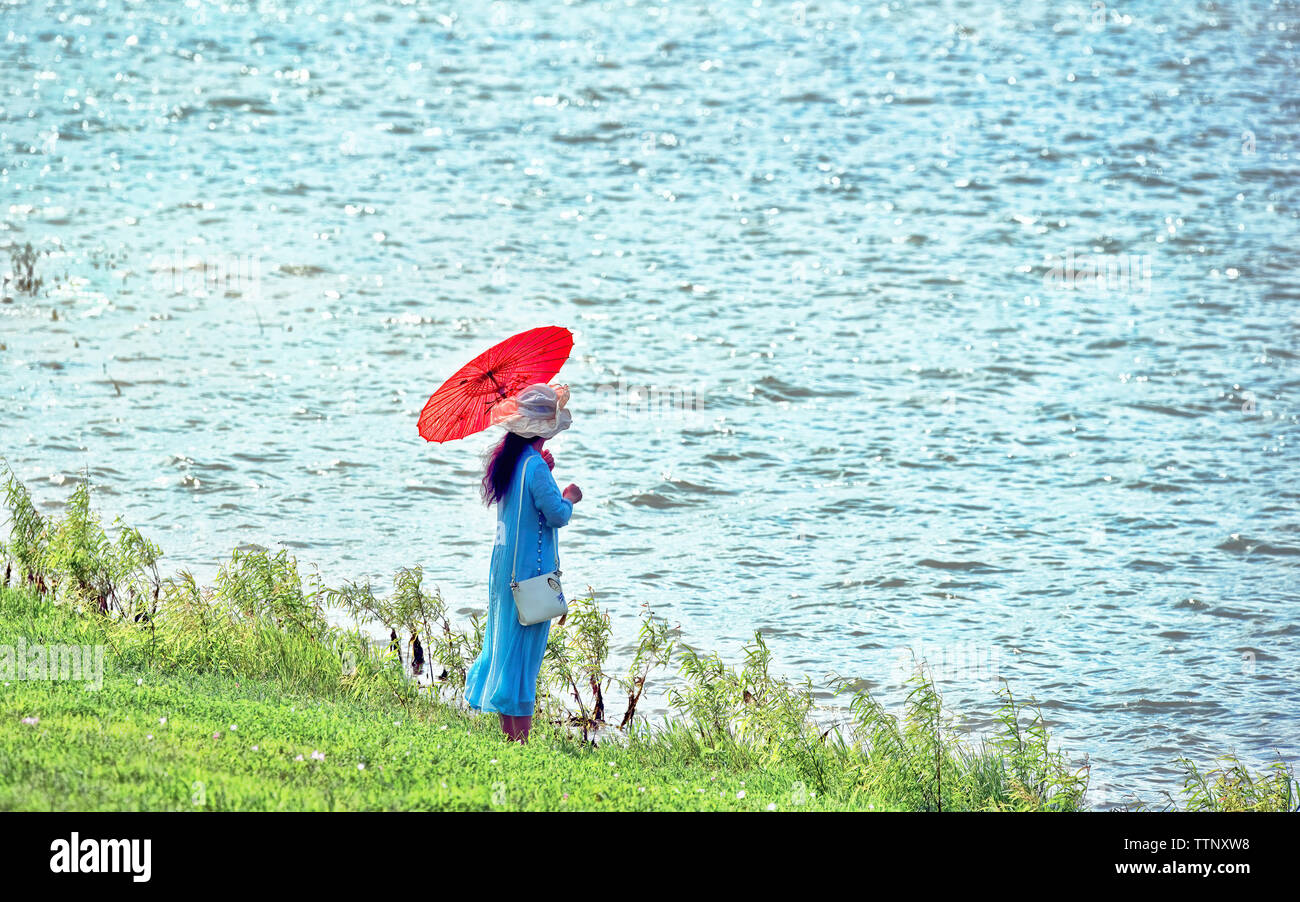Life is good down by the river for a pretty lady Stock Photo - Alamy