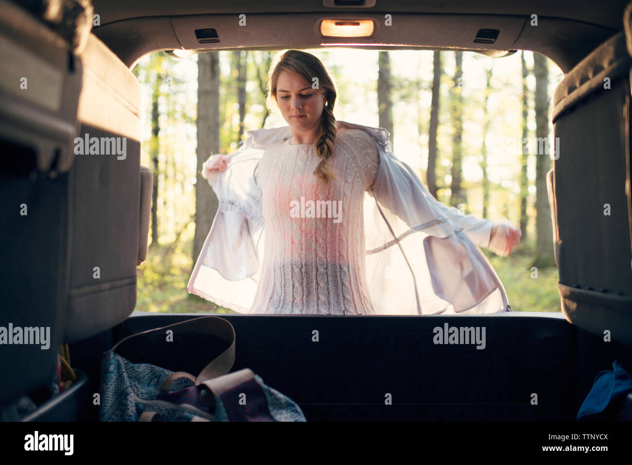 Removing jacket hi-res stock photography and images - Alamy