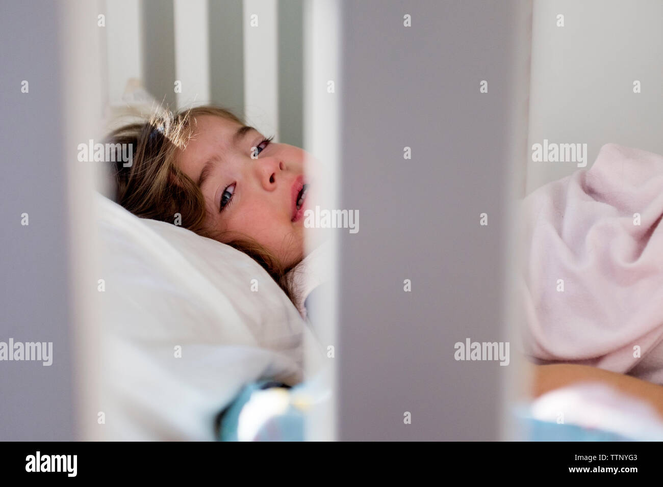 Baby crying in crib hi-res stock photography and images - Alamy