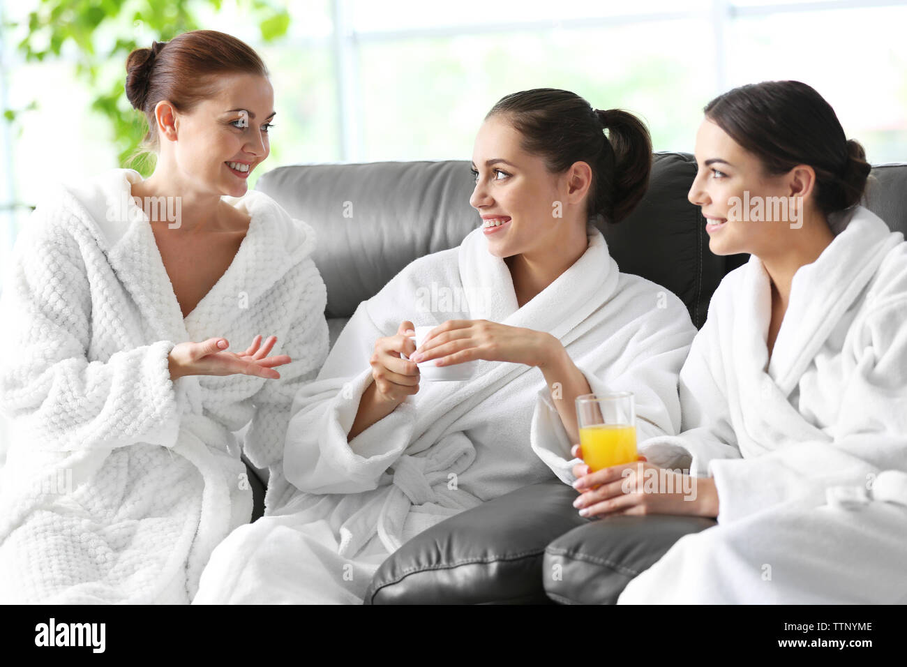 Beautiful girls relaxing in spa salon Stock Photo - Alamy