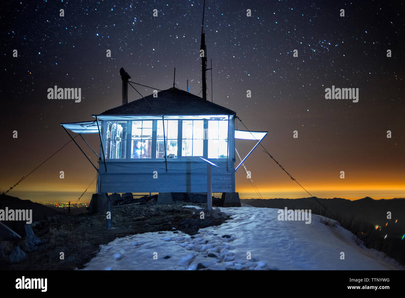 Illuminated lookout tower on Burley Mountain against sky at night Stock ...