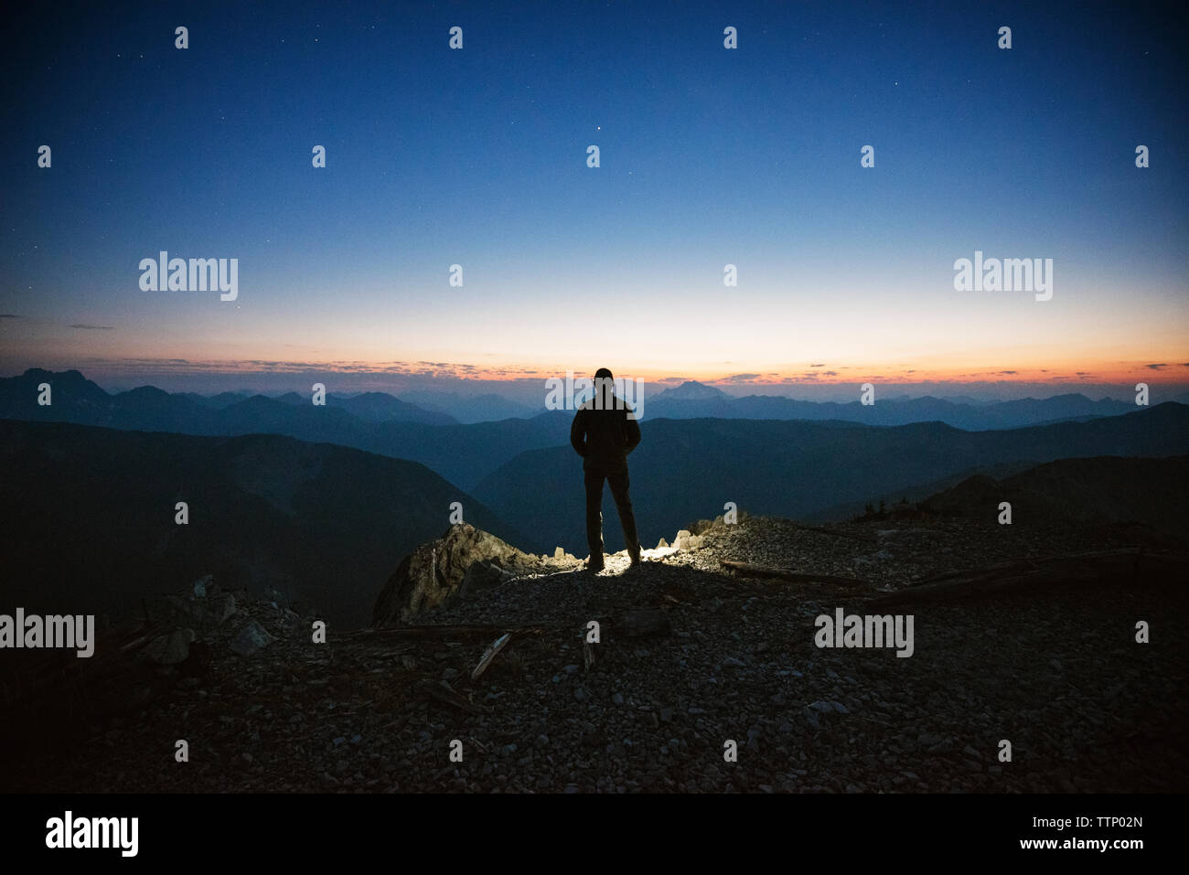 Man standing mountain light sky hi-res stock photography and images - Alamy