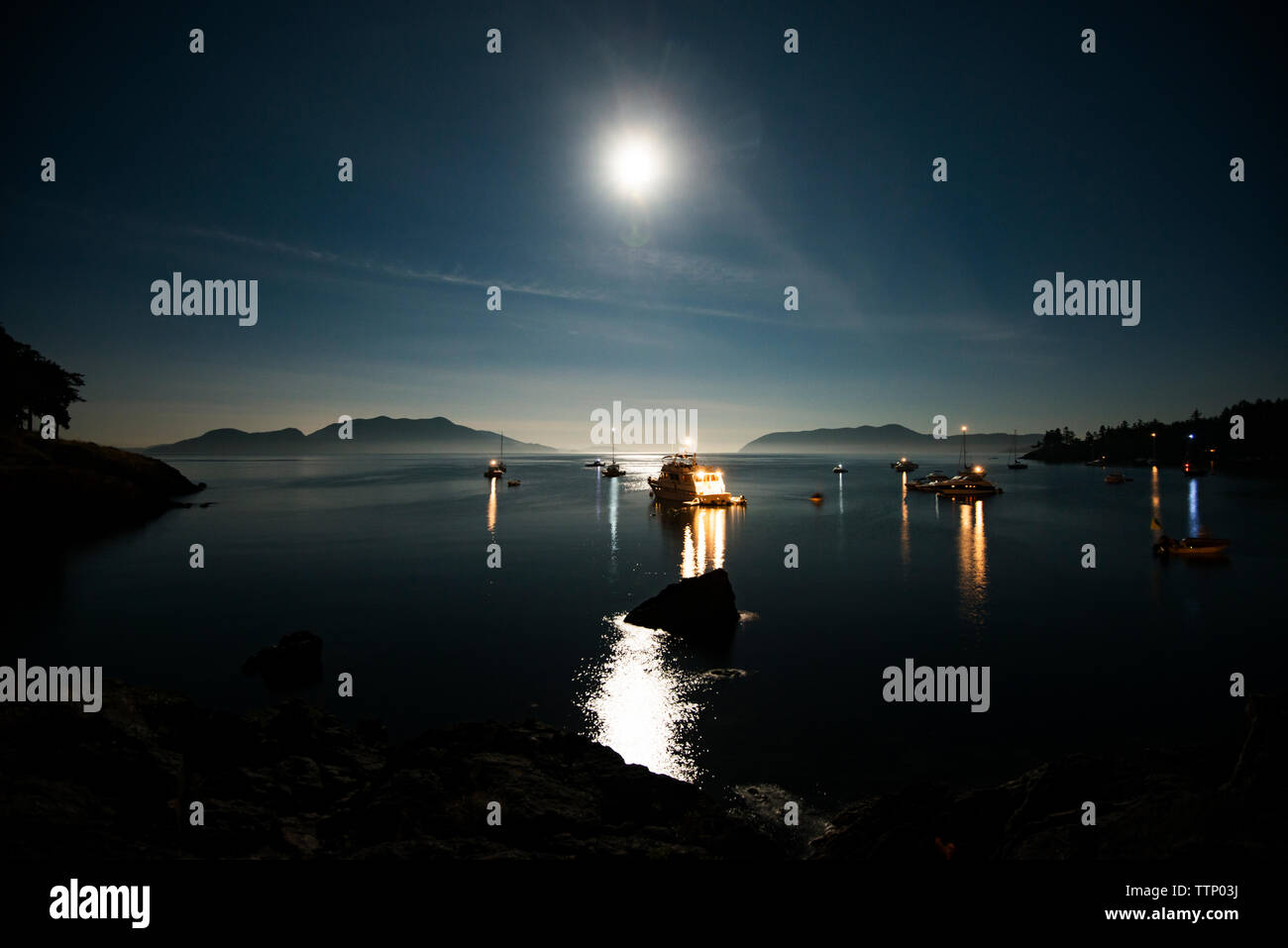 Sky reflection in water with boats hi-res stock photography and images ...