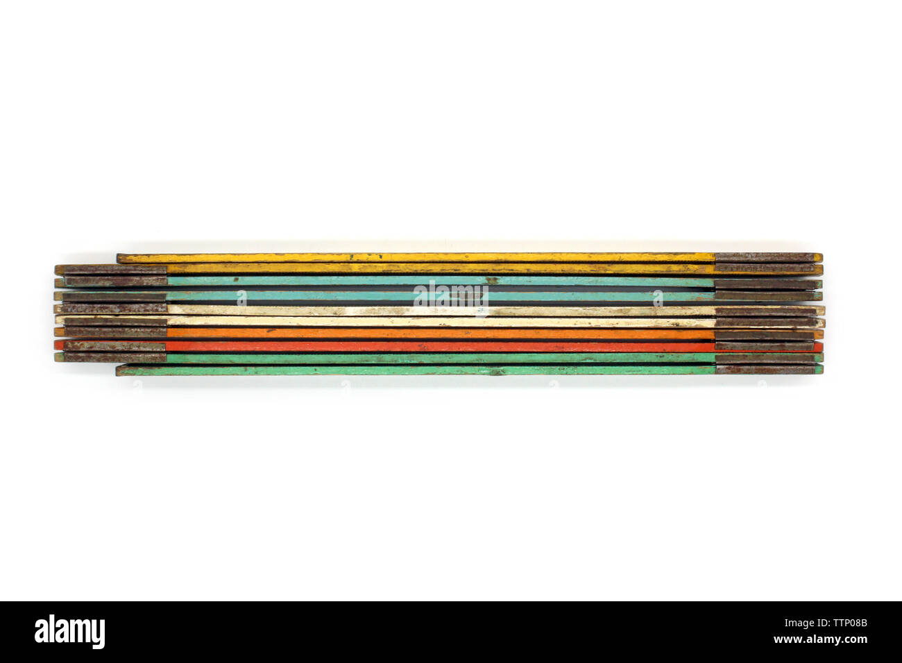 Vintage multi color wooden folding ruler isolated on a white background ...
