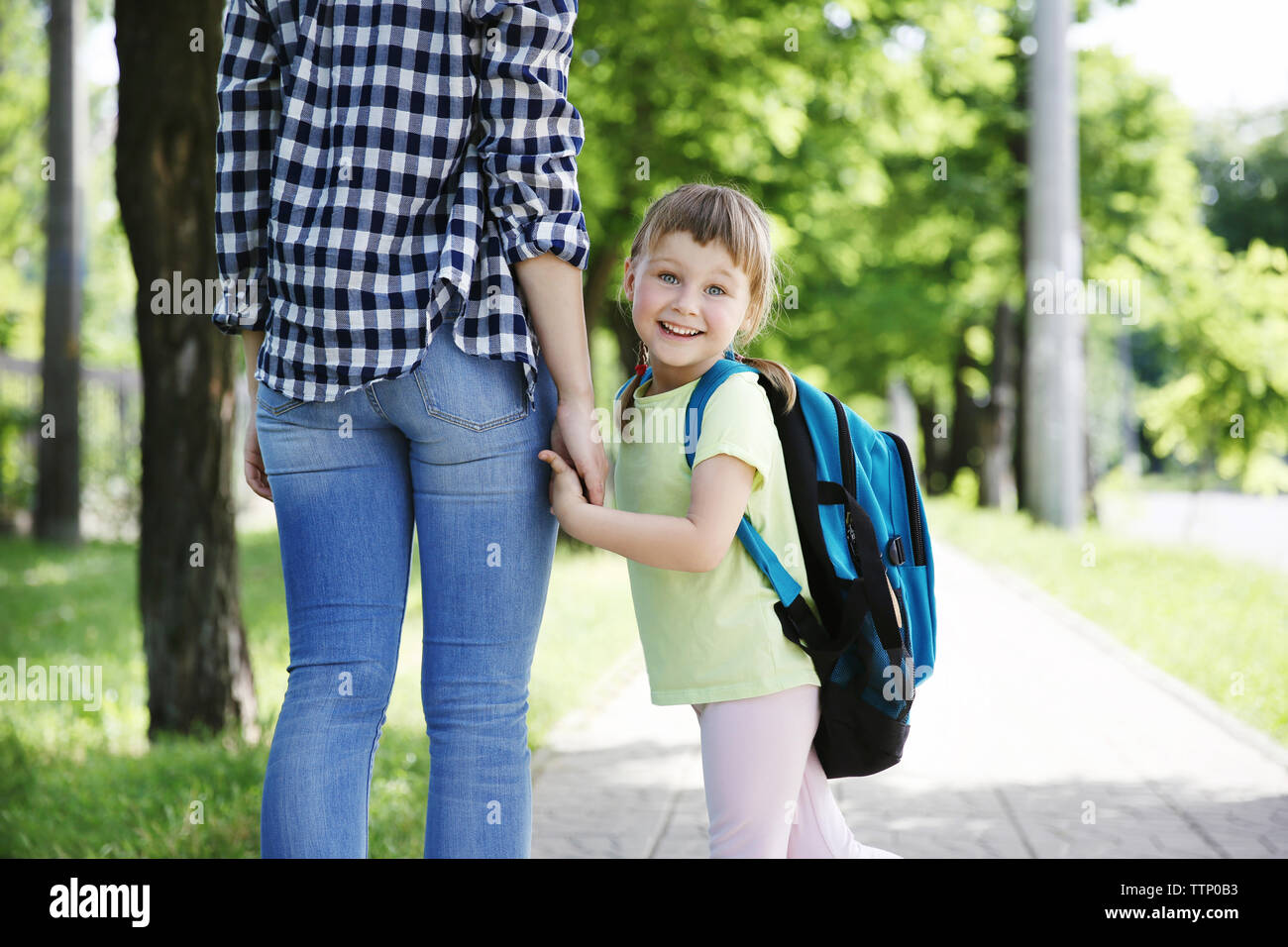 Mother taking daughter to school Stock Photo - Alamy