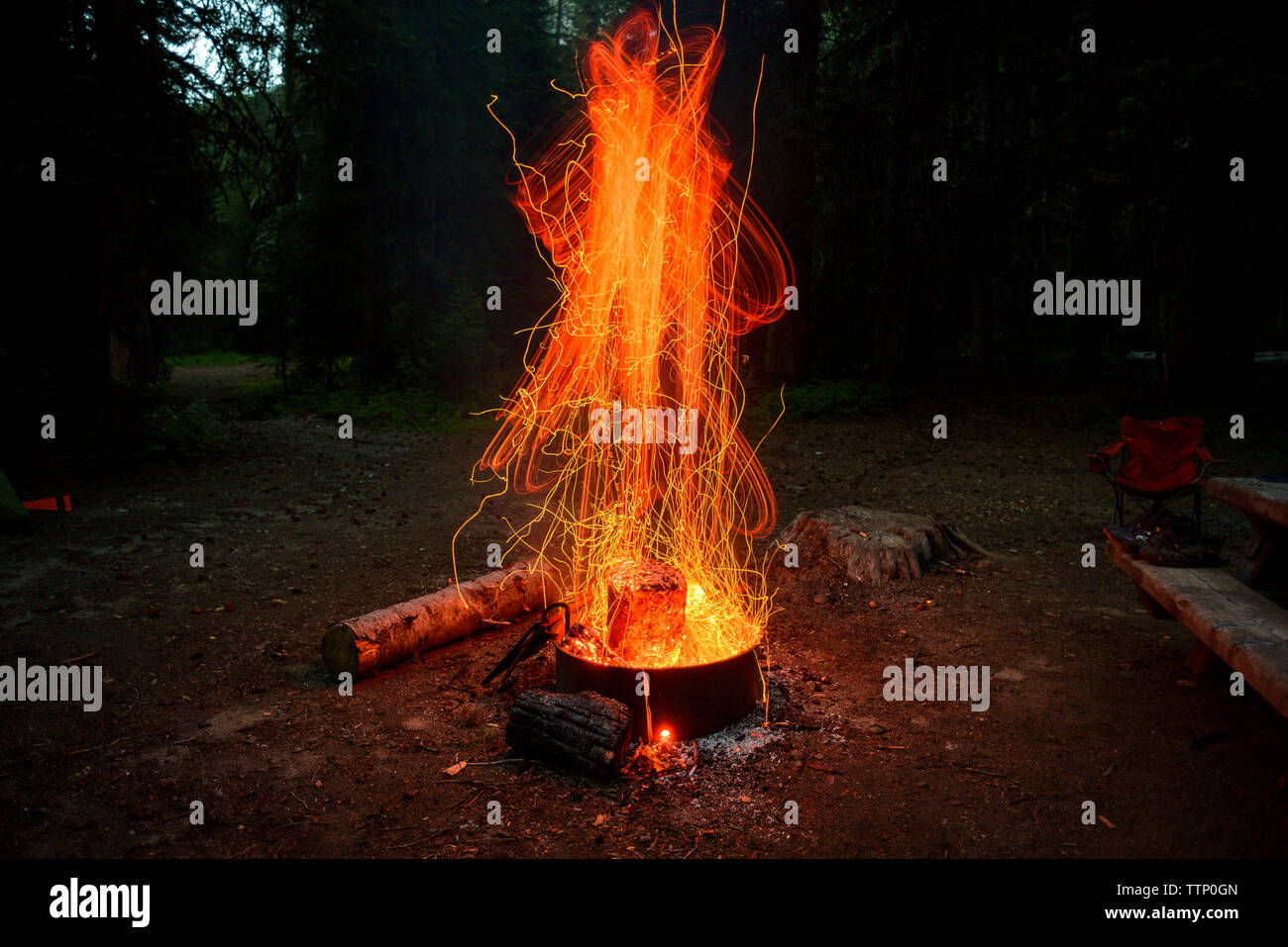 Close-up of campfire burning at campsite Stock Photo - Alamy