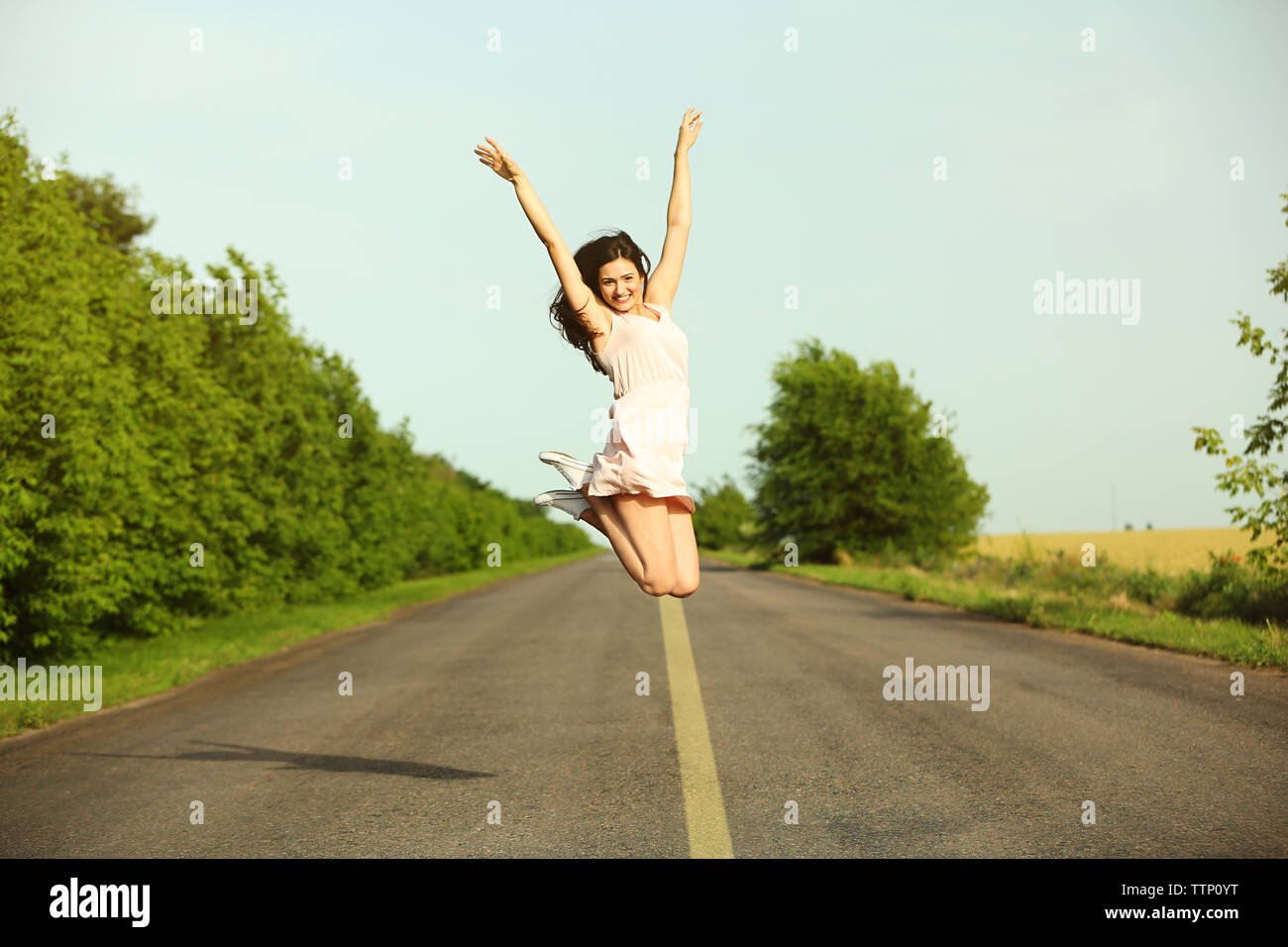 Beautiful girl on road Stock Photo - Alamy