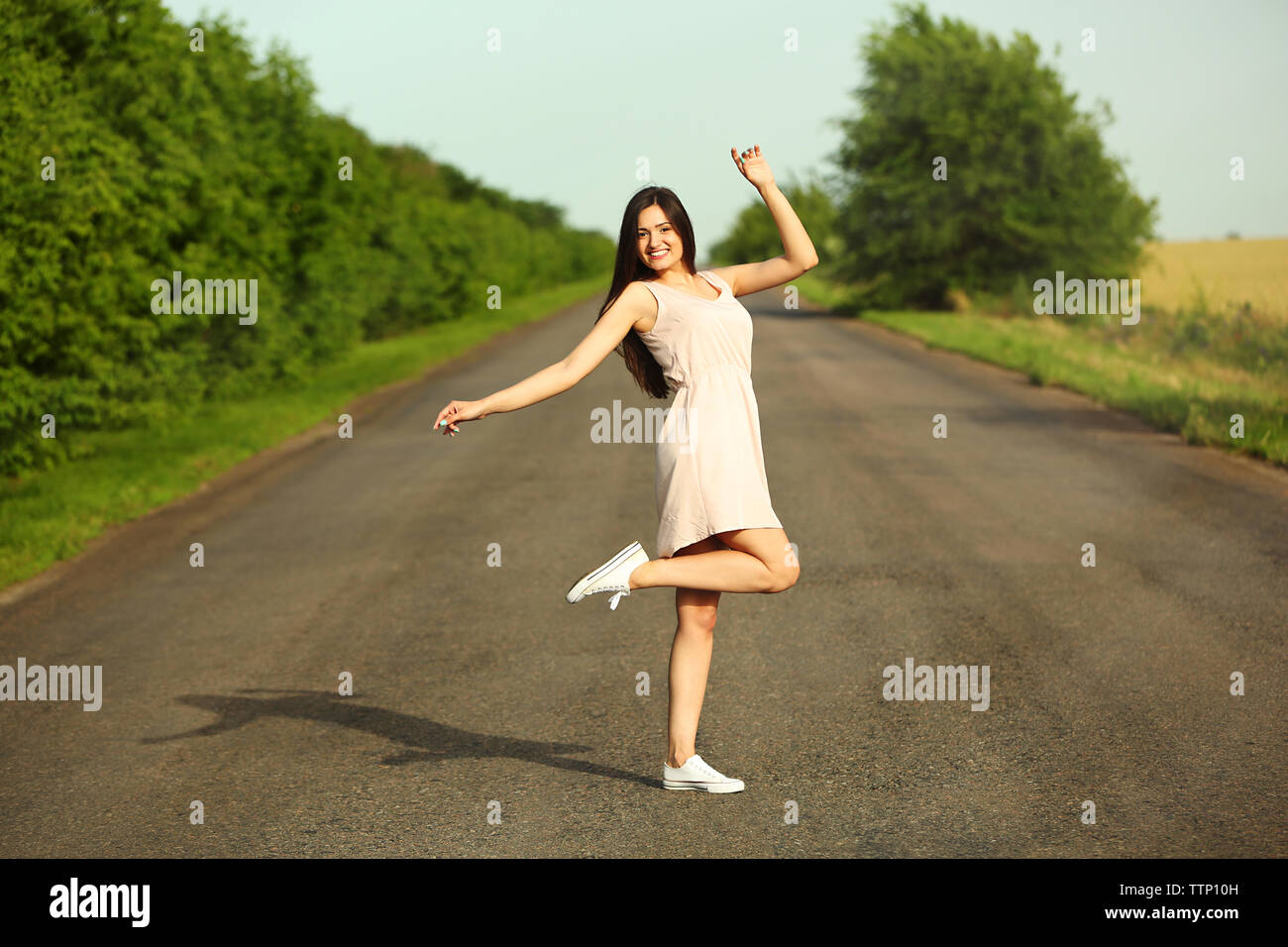 Beautiful girl on road Stock Photo - Alamy