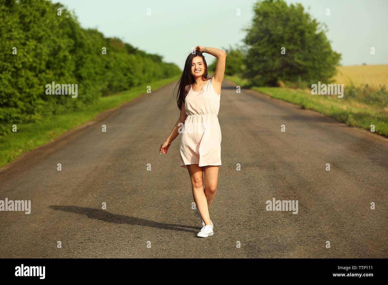 Beautiful girl on road Stock Photo - Alamy
