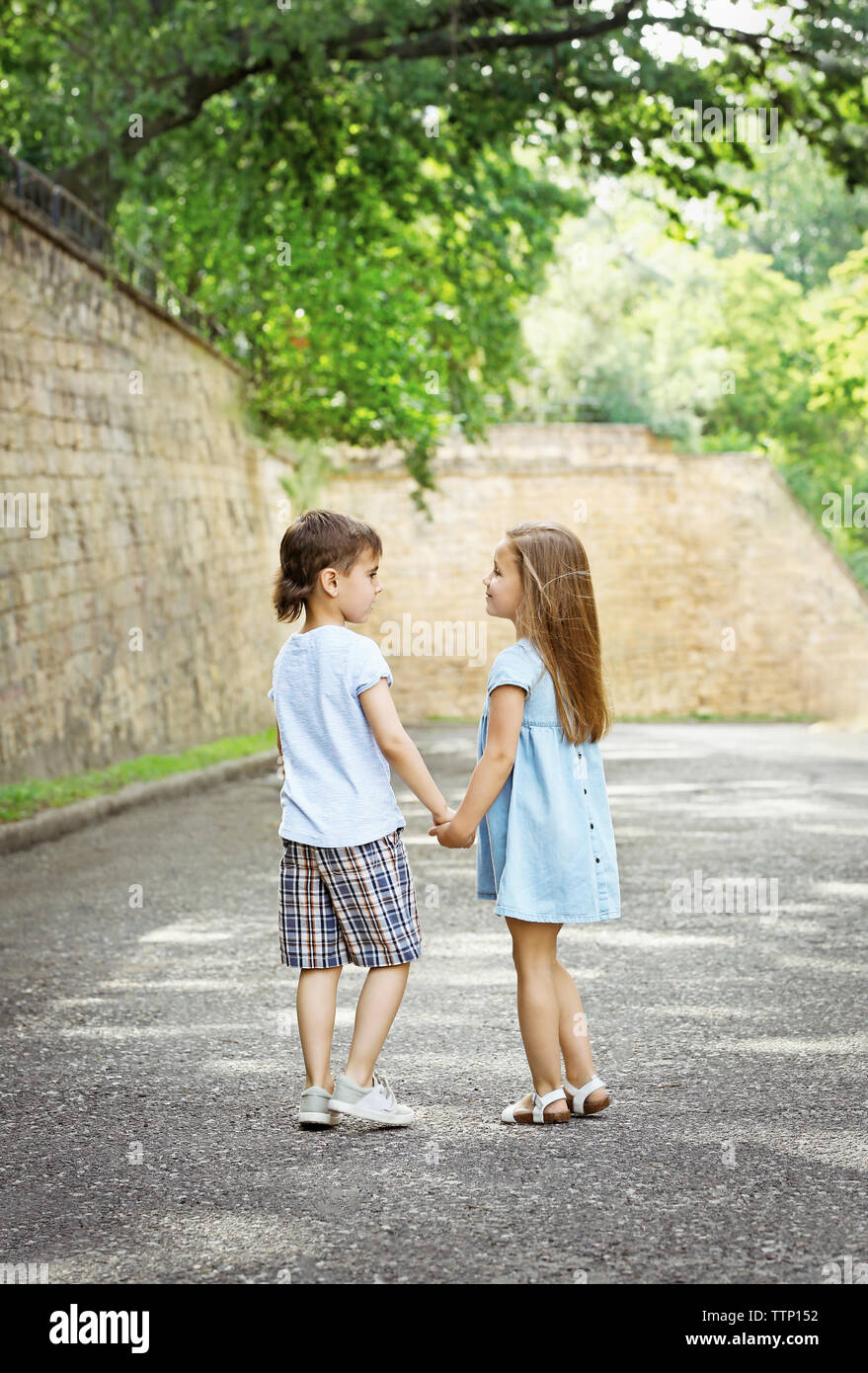 Small friendly kids on street Stock Photo - Alamy