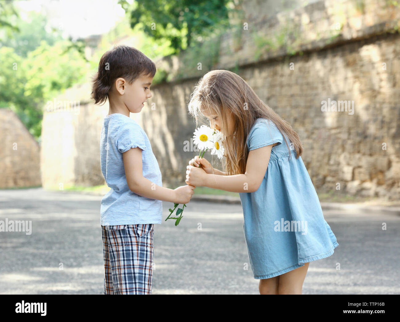 Small friendly kids on street Stock Photo - Alamy