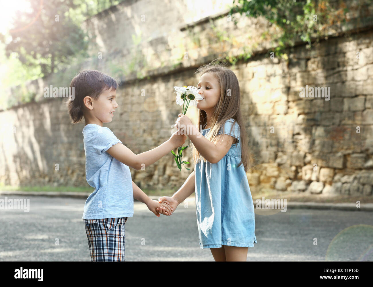 Small friendly kids on street Stock Photo - Alamy