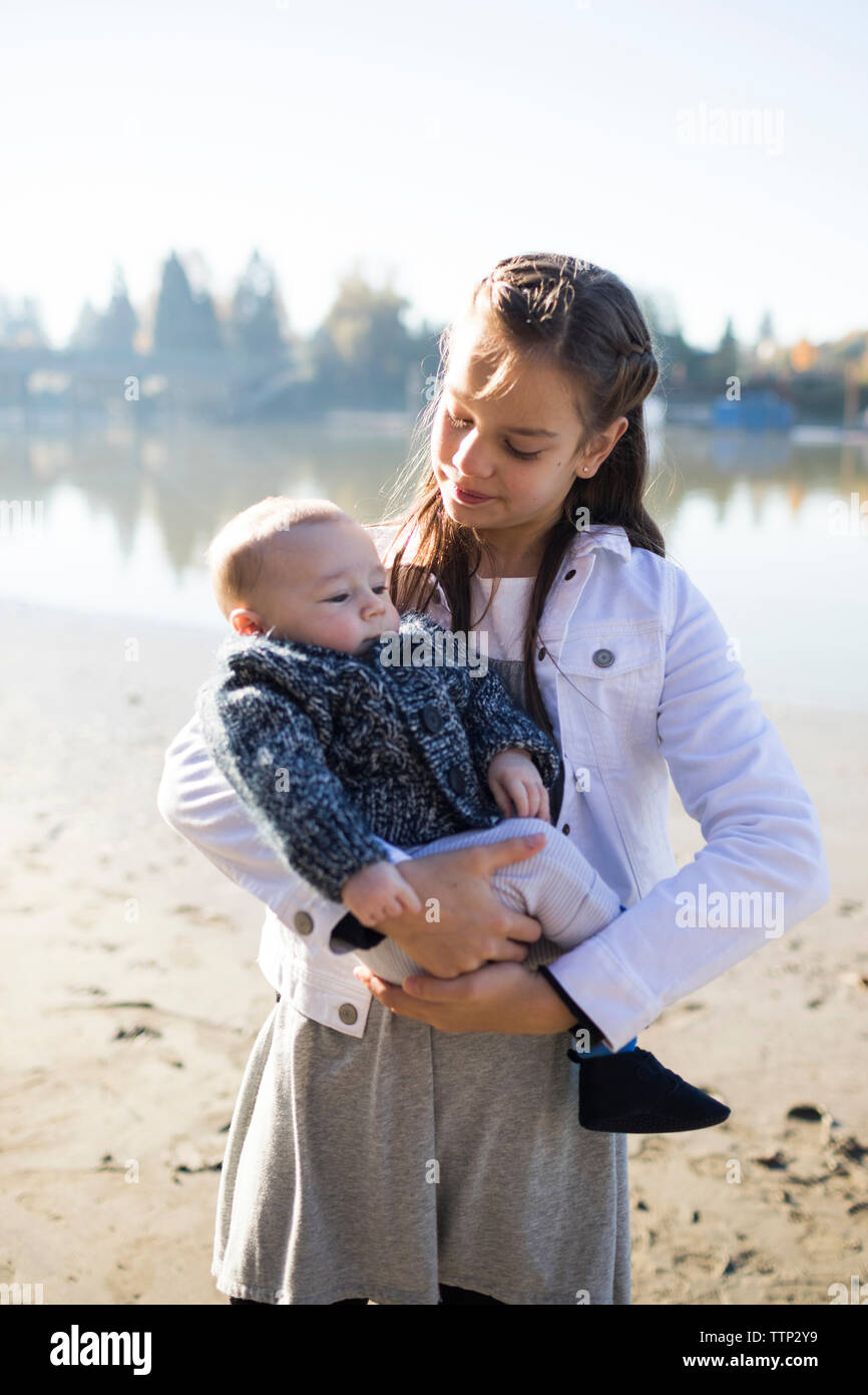 Sister carrying brother hi-res stock photography and images - Alamy