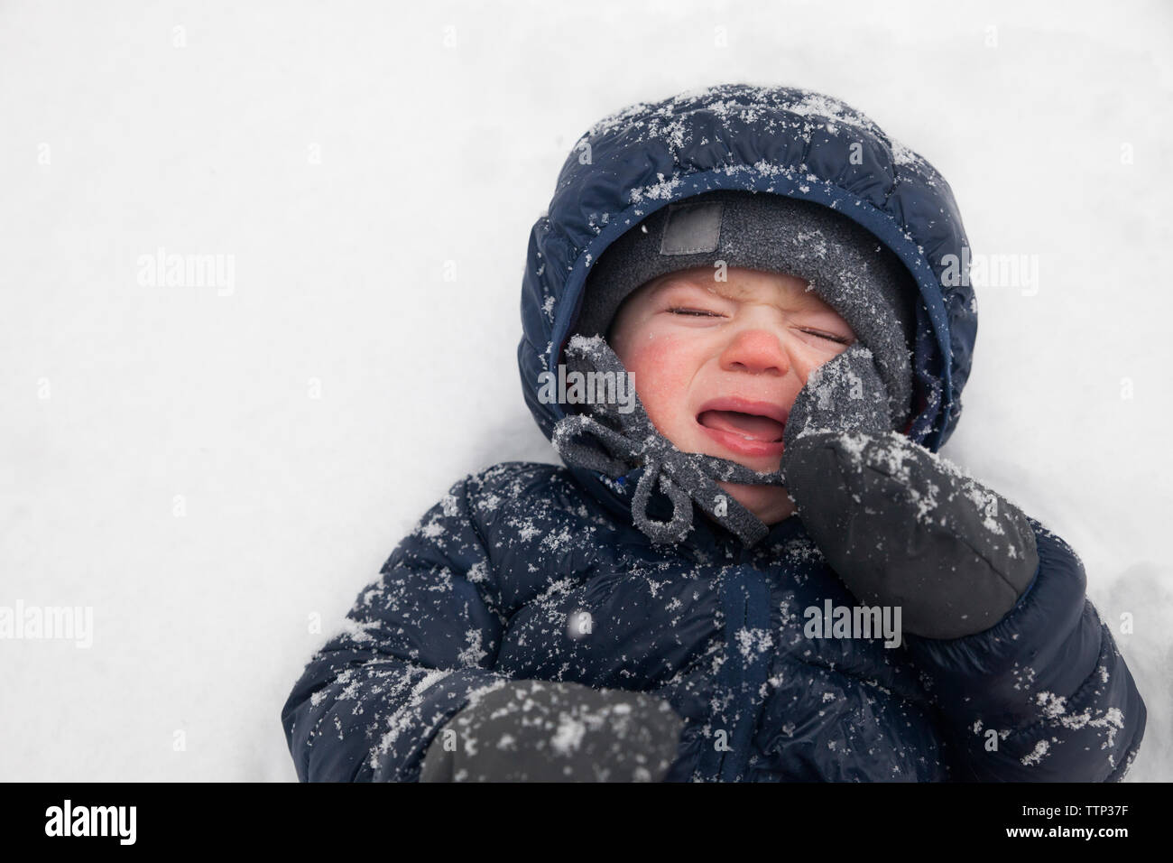 Sad boy snow hi-res stock photography and images - Alamy