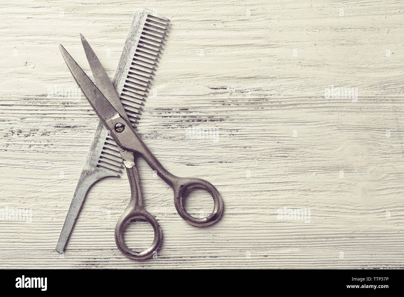 Vintage tools of barber shop on light wooden background Stock Photo - Alamy