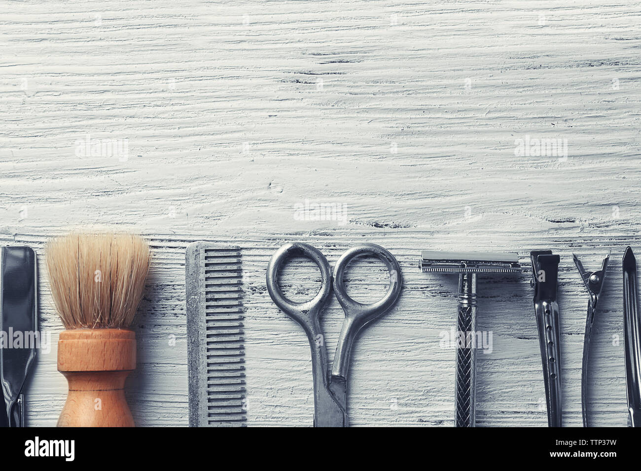 Vintage tools of barber shop on light wooden background Stock Photo - Alamy