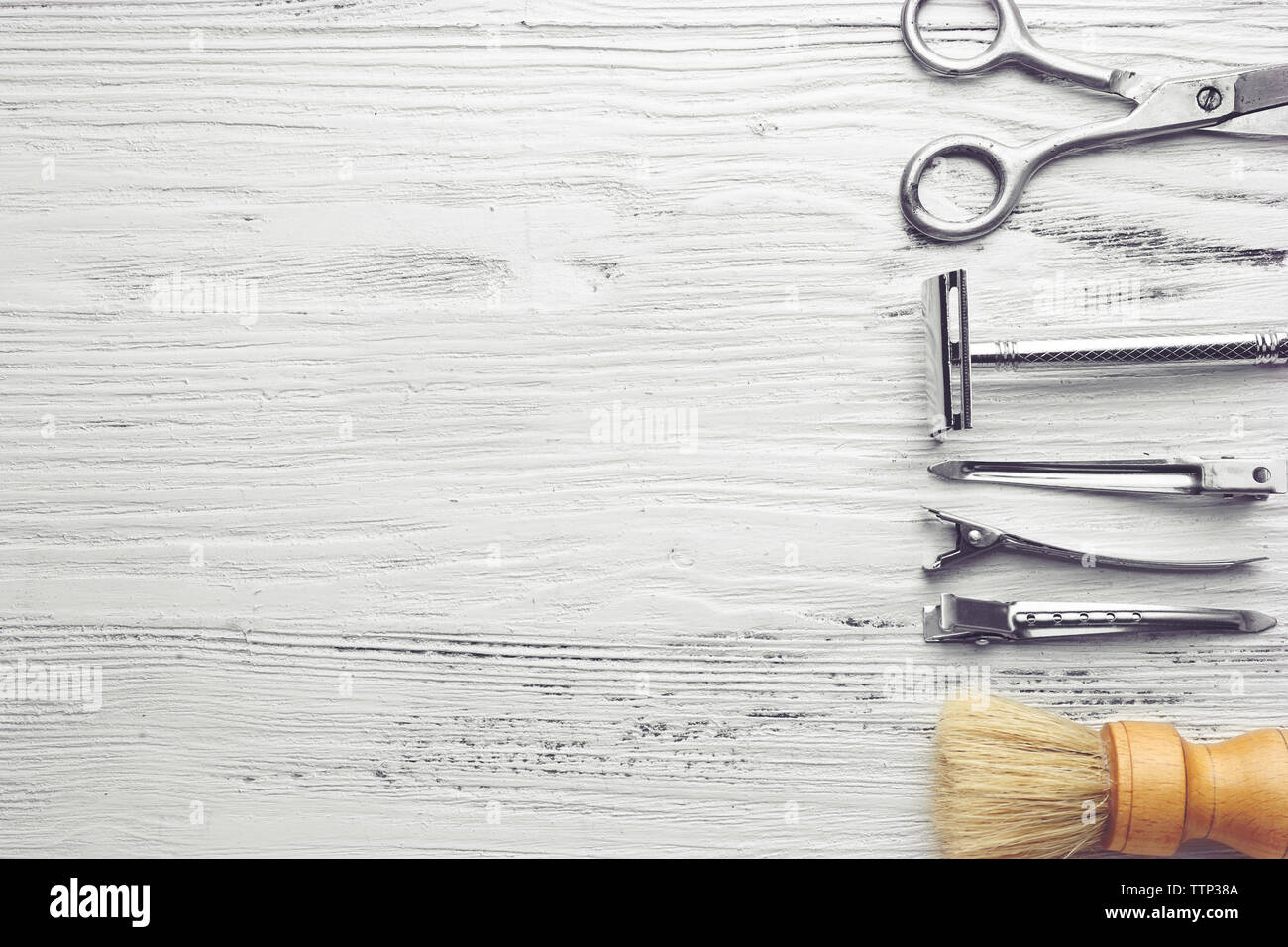 Vintage tools of barber shop on light wooden background Stock Photo - Alamy