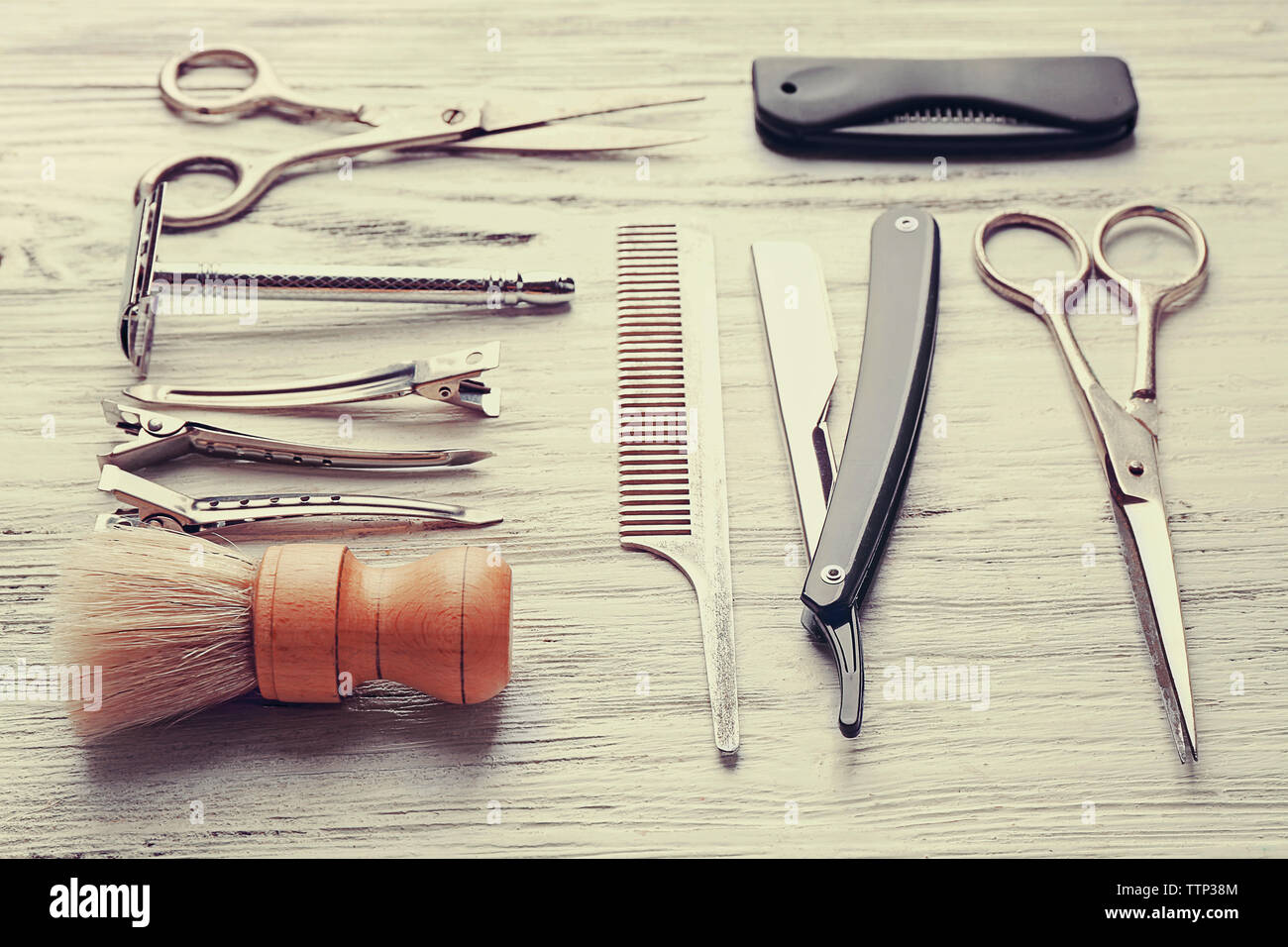 Vintage tools of barber shop on light wooden background Stock Photo - Alamy